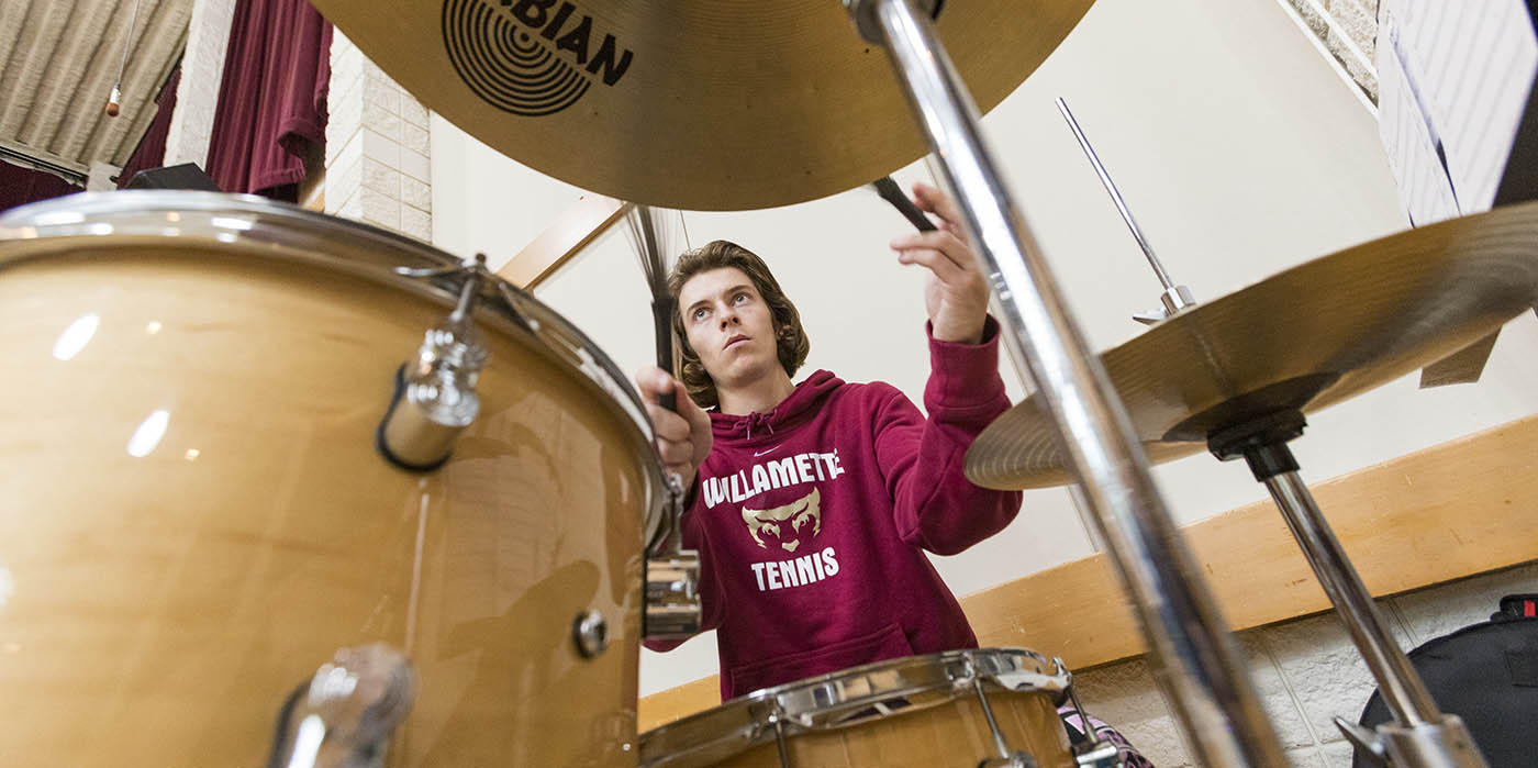 A Willamette music student playing drums.