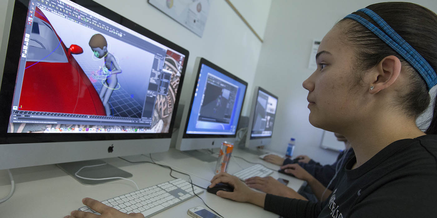A Willamette student in a Cinema Studies classroom